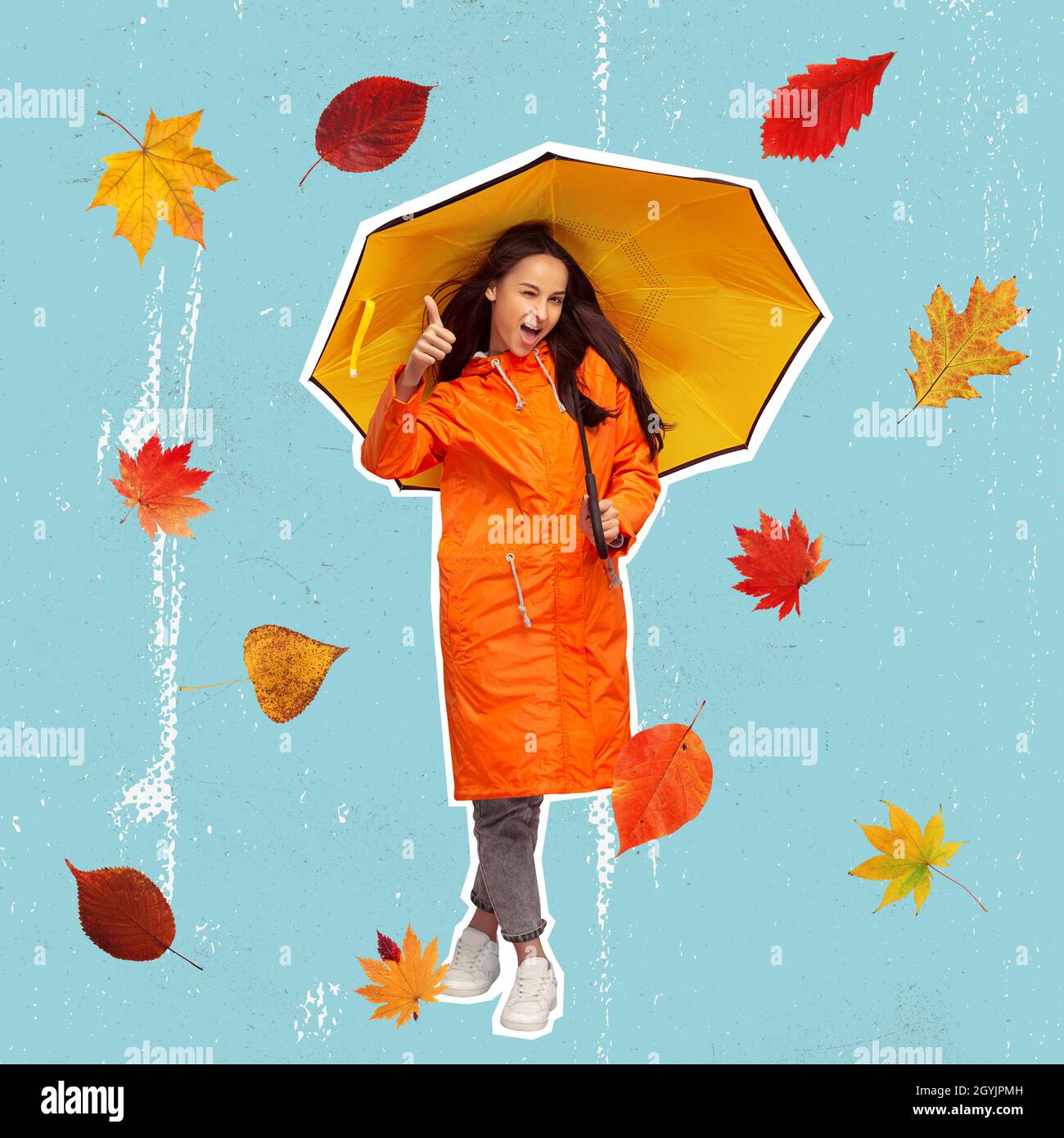 Woman in bright raincoat with umbrella walking under leaf fall. Autumn ...