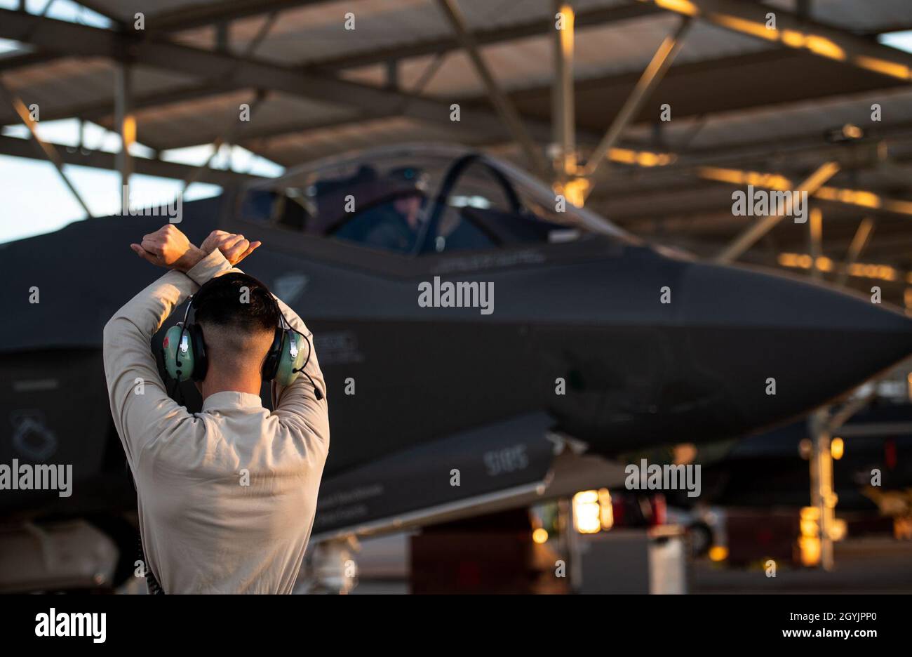 A 63rd Aircraft Maintenance Unit crew chief marshals in an F-35A ...