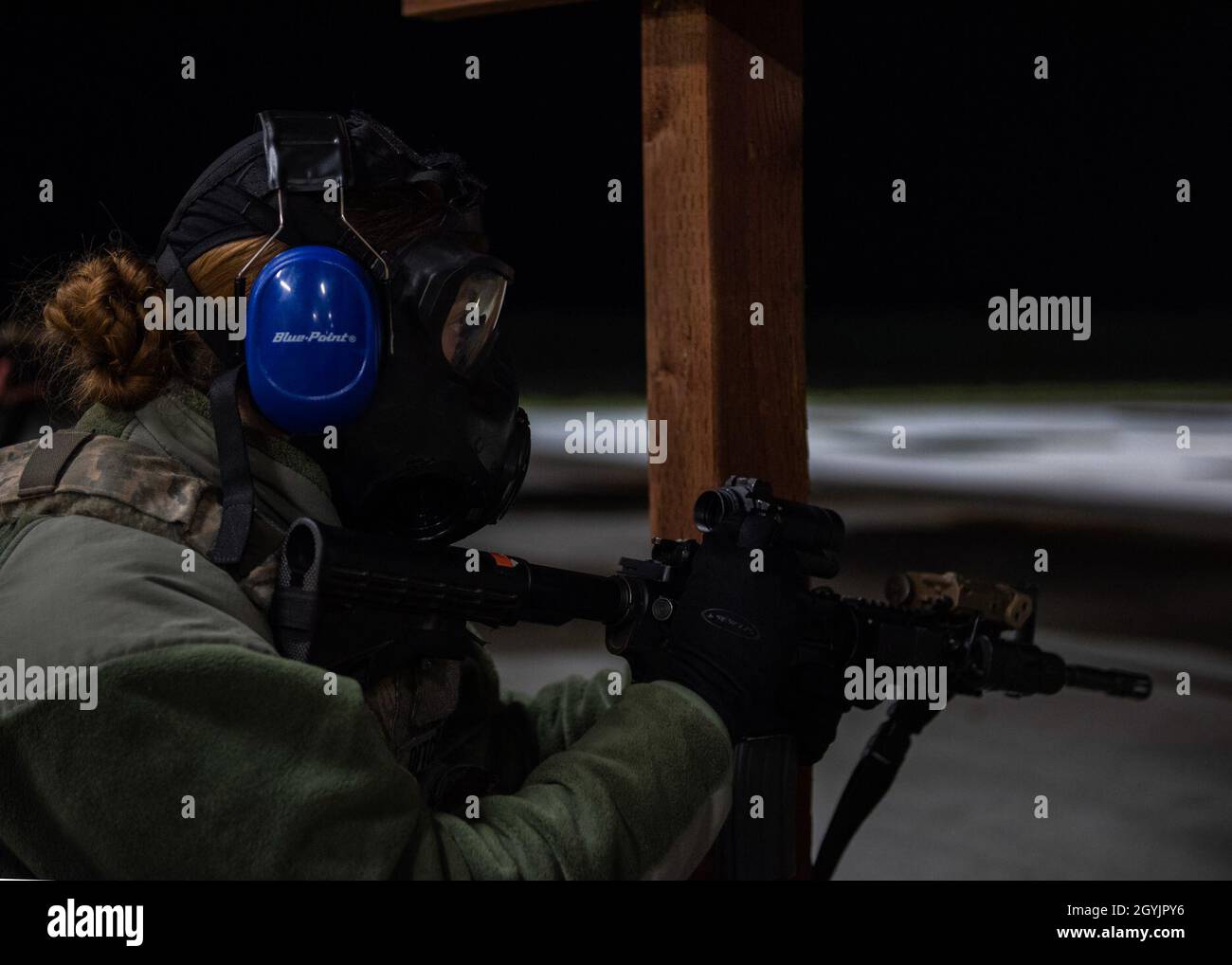 An Airman from the 9th Security Forces Squadron prepares to fire her M4 ...