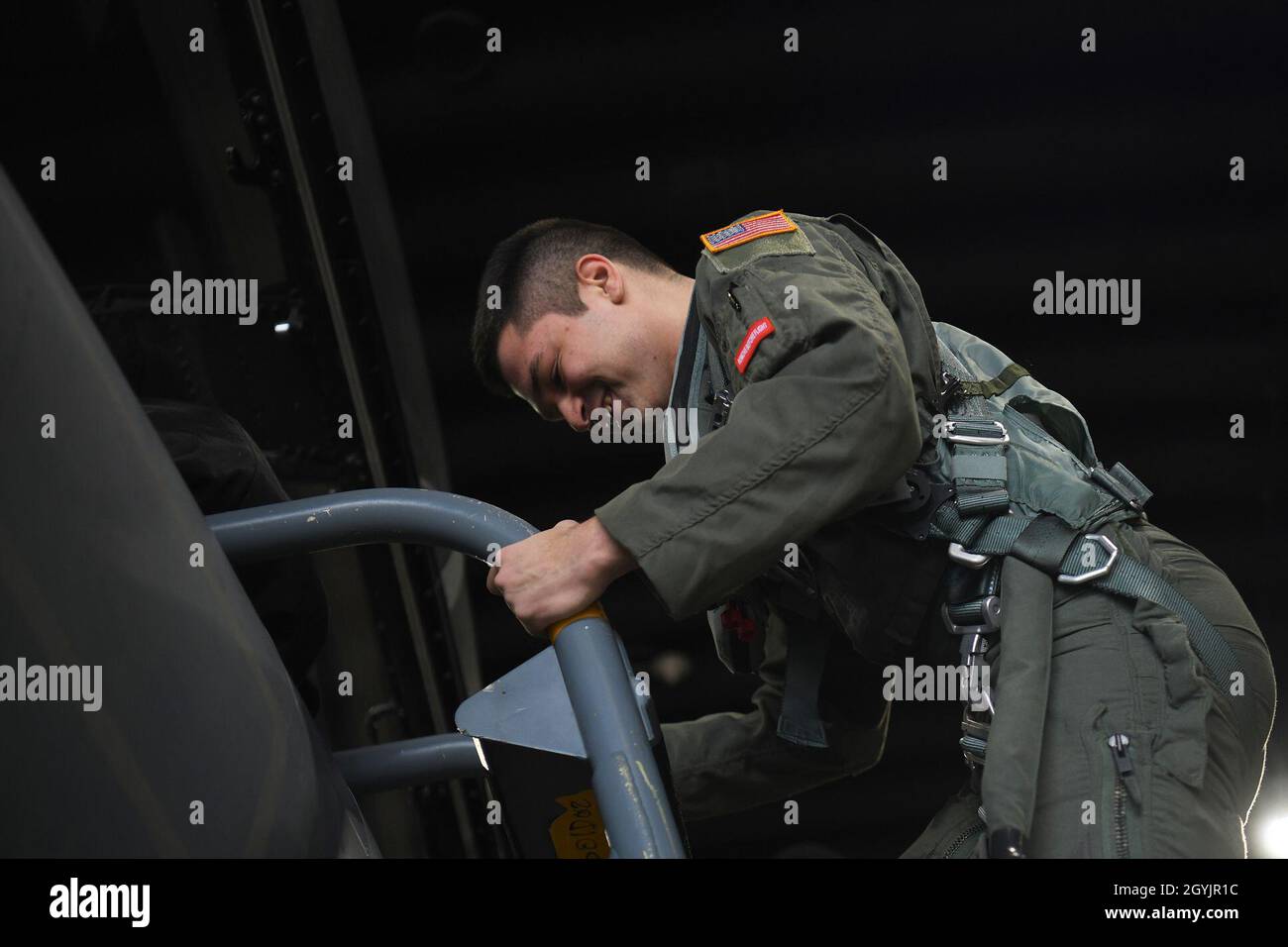 Civil Air Patrol Cadet Colonel Zane Fockler ascends a ladder to an F ...