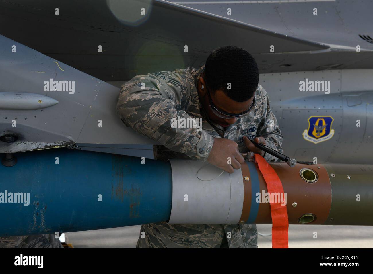 Senior Airman Darrell Moore, 310th Aircraft Maintenance Unit weapons ...