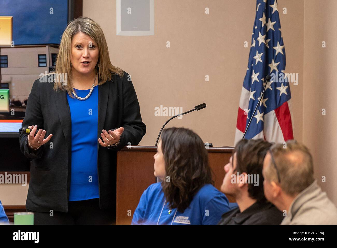 Kristyn Smith, public affairs officer, leads a mission briefing for ...