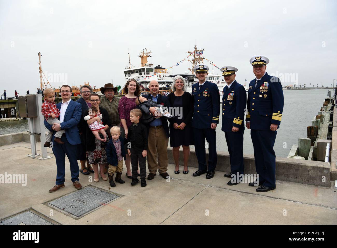 The official party poses with members of Chief Petty Officer Daniel ...