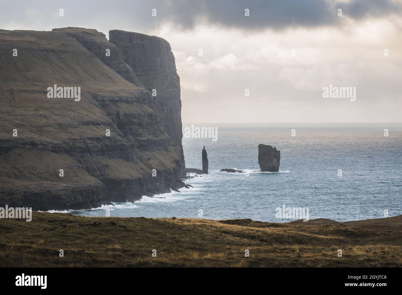 Steep cliffs of Faroe Islands. Vertical cliffs. Massive rocky cliffs ...