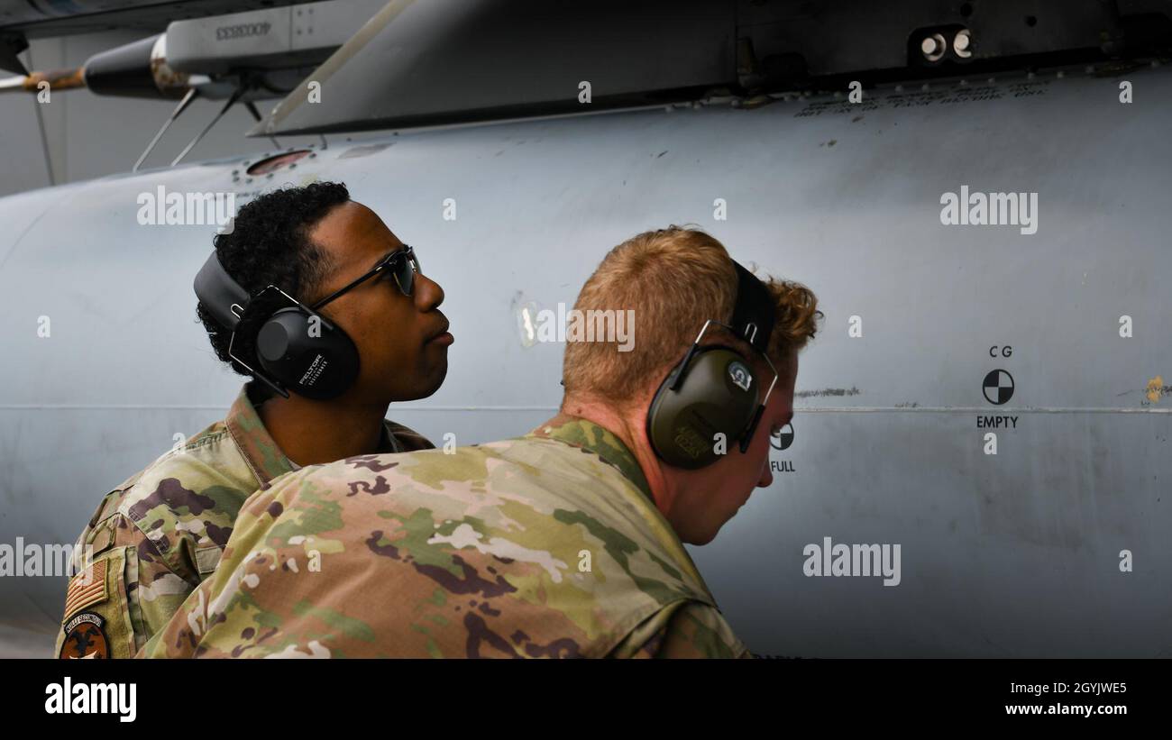 Maintainers from the 18th Aircraft Maintenance Squadron inspect an F ...