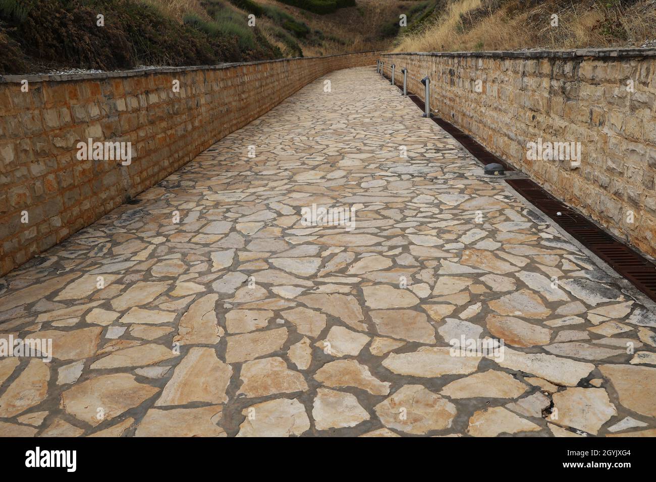 The road is paved with natural stone Stock Photo - Alamy