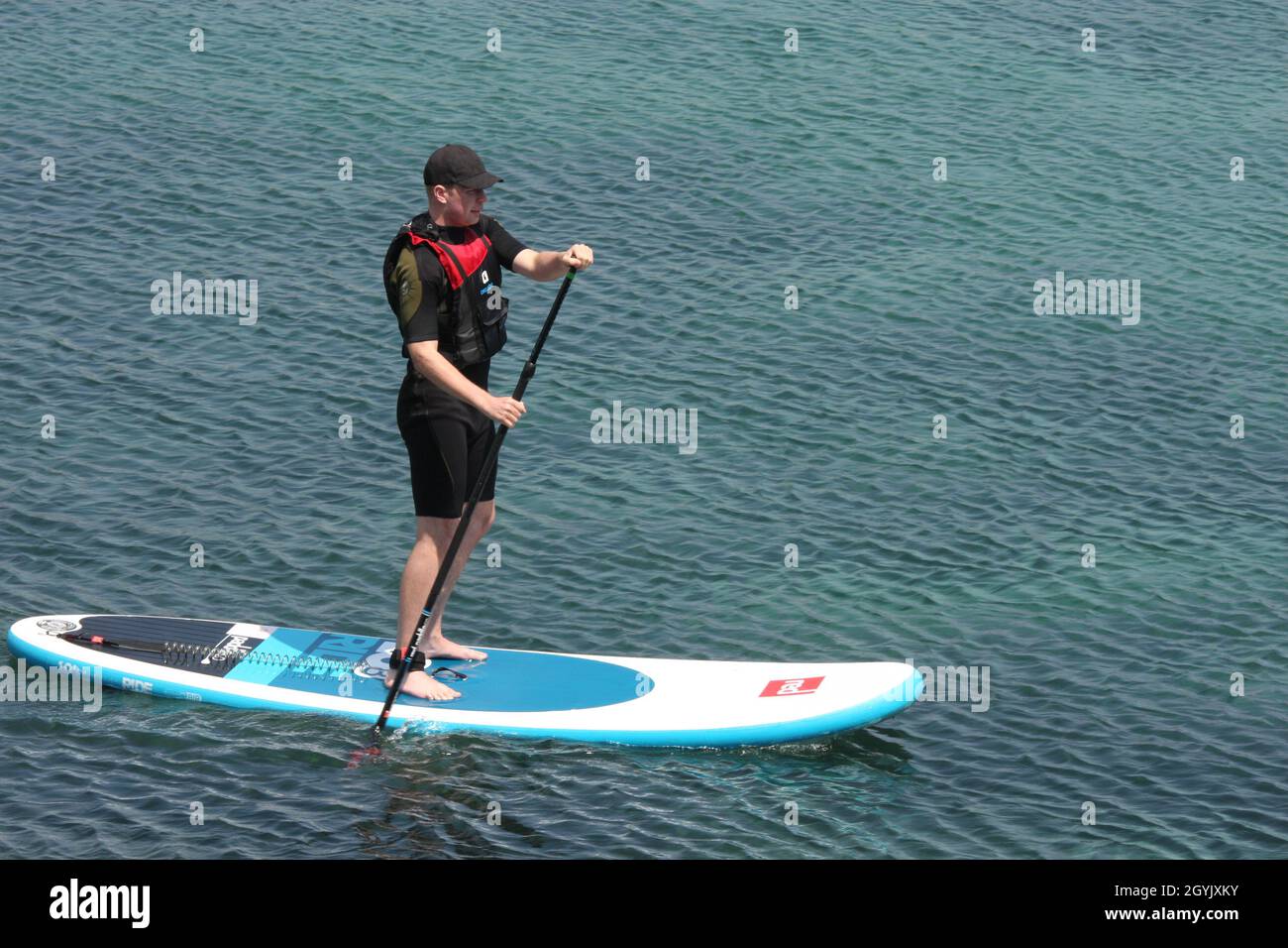 Man paddling on paddleboard, Cornwall, UK Stock Photo - Alamy