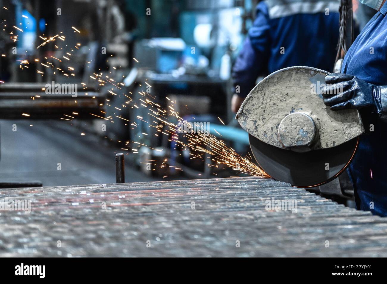 Cutting rolled metal using a powerful abrasive wheel cutting machine ...