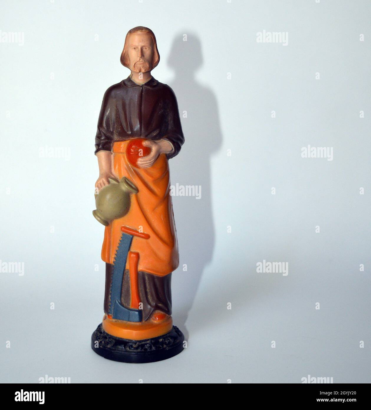Vertical shot of a Catholic religious figurine of Saint Joseph holding ...