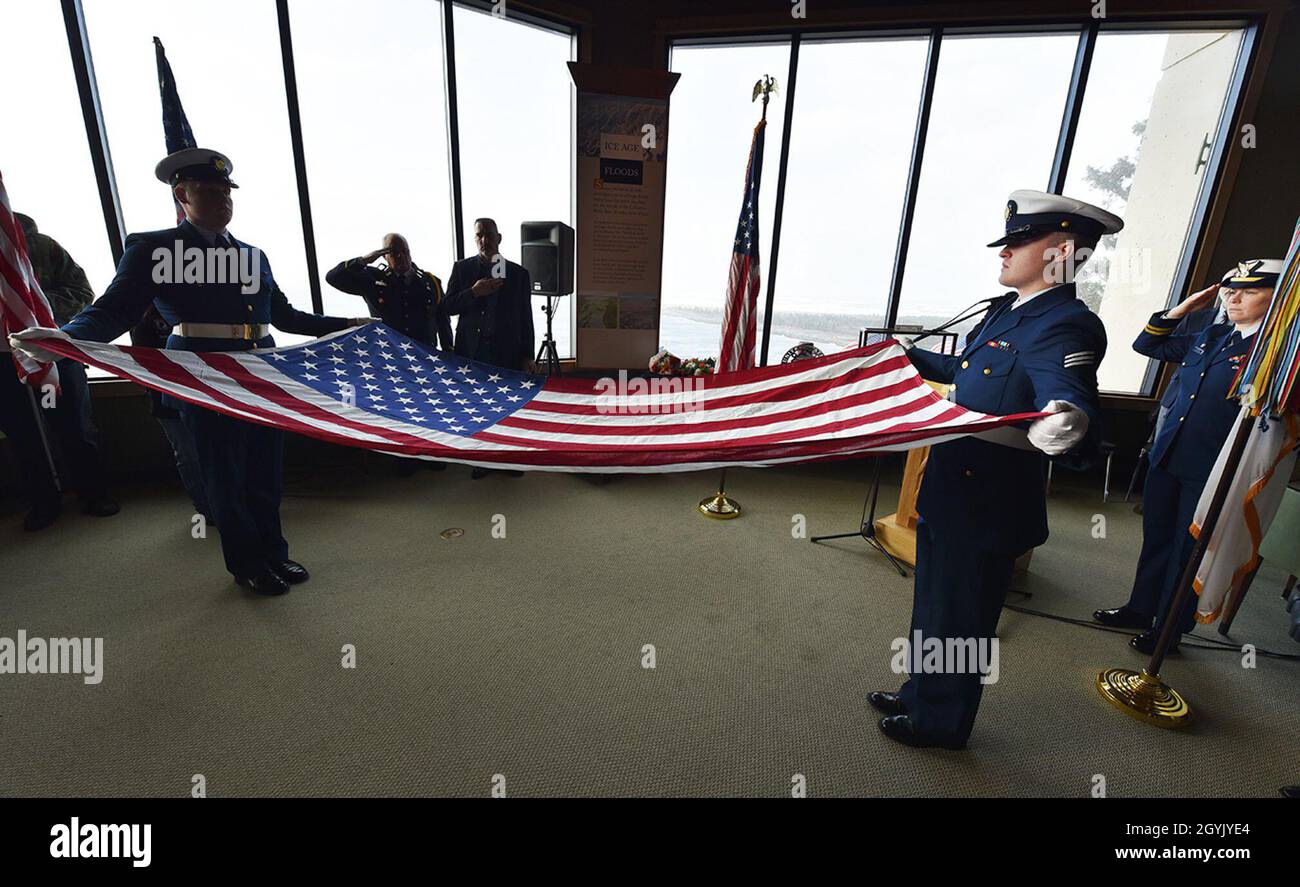Crewmembers from Coast Guard Station Cape Disappointment fold the ...