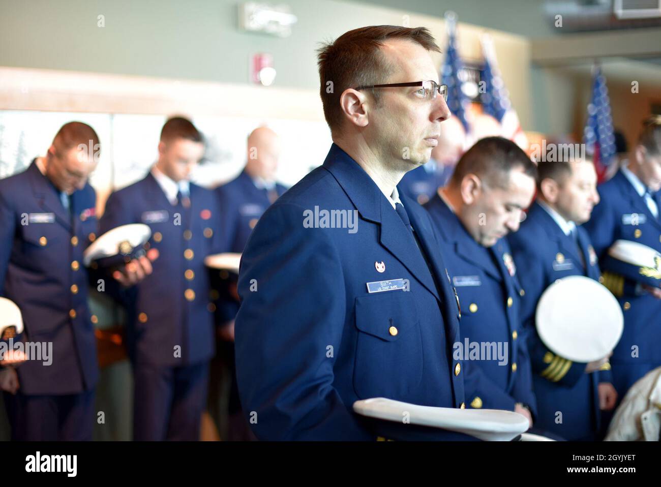 Capt. Jeremy Smith, commander, Sector Columbia River, looks on somberly ...