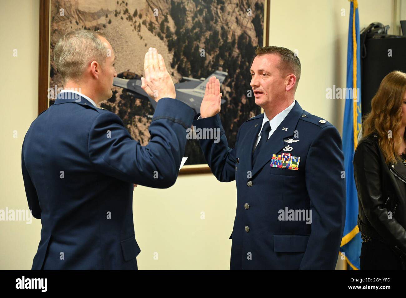 Col. Mark Morrell, 114th Fighter Wing commander, administers the oath ...