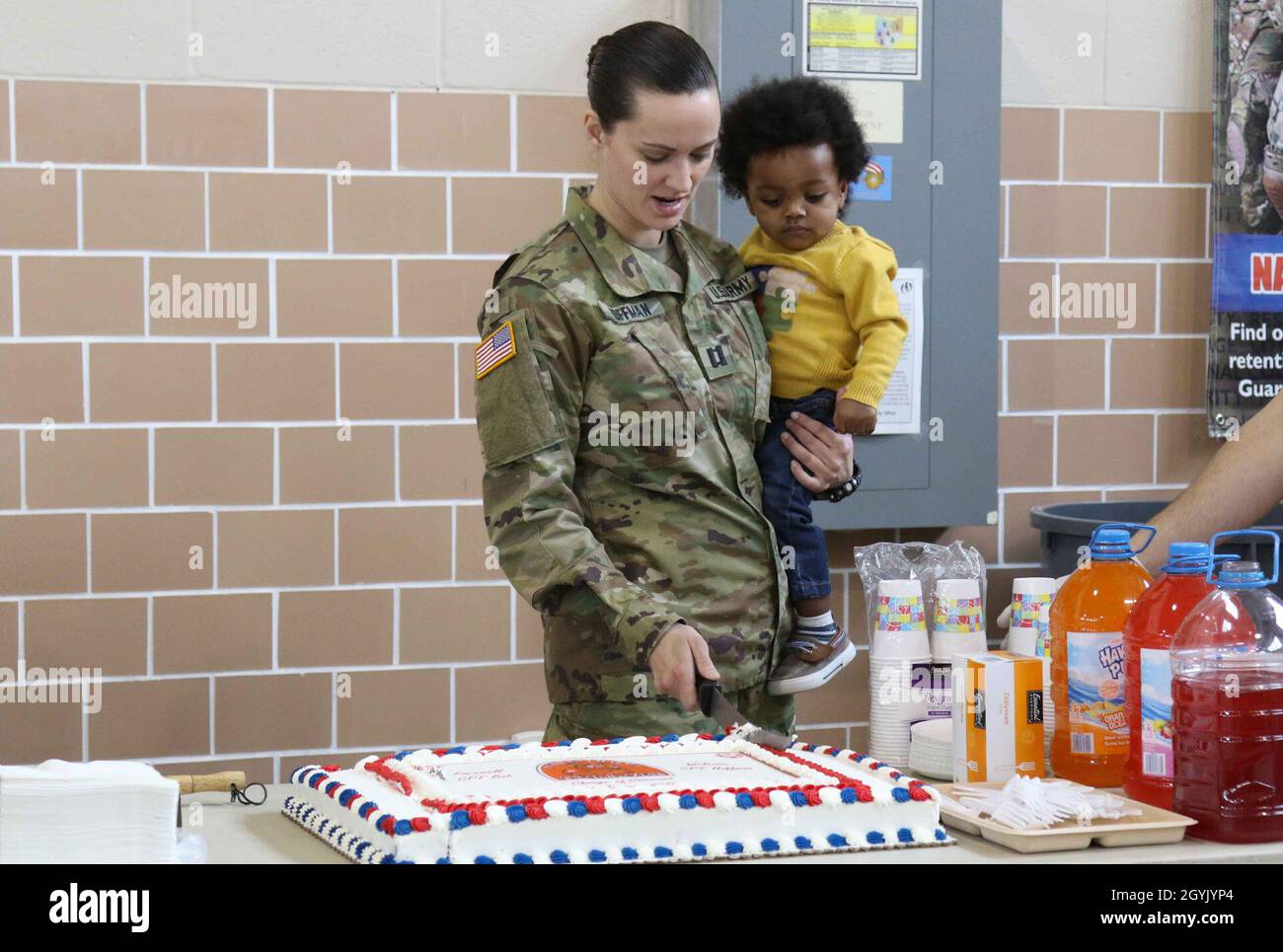 Capt. Jill Hoffman cuts the cake after a change of command ceremony at ...