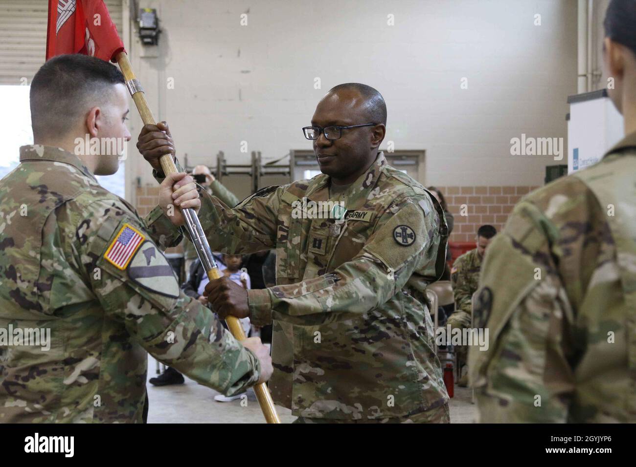Capt. Sulaiman Bah receives the guidon for the last time as the ...