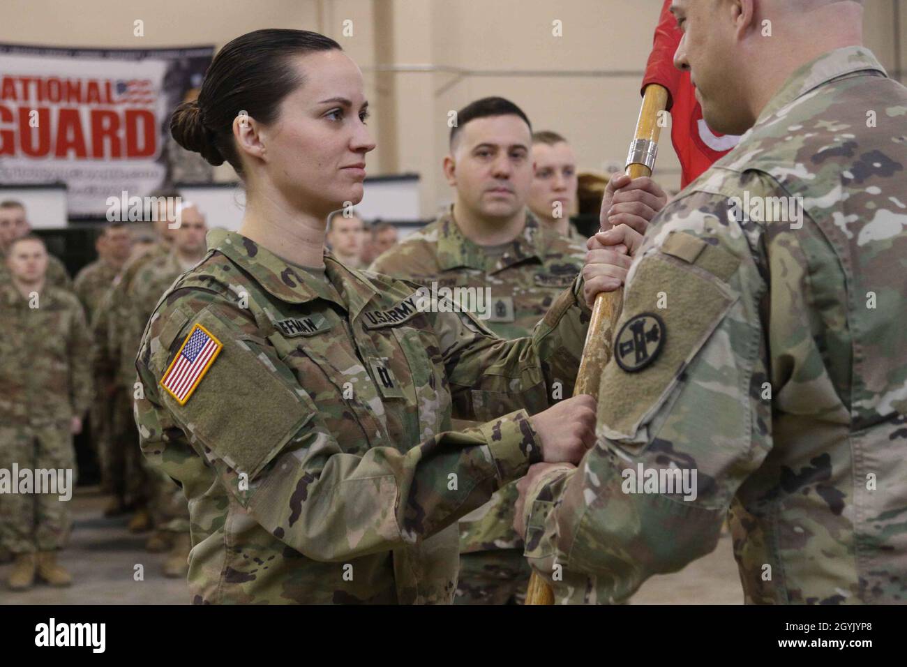 Capt. Jill Hoffman receives the 945th Engineer Company guidon during a ...