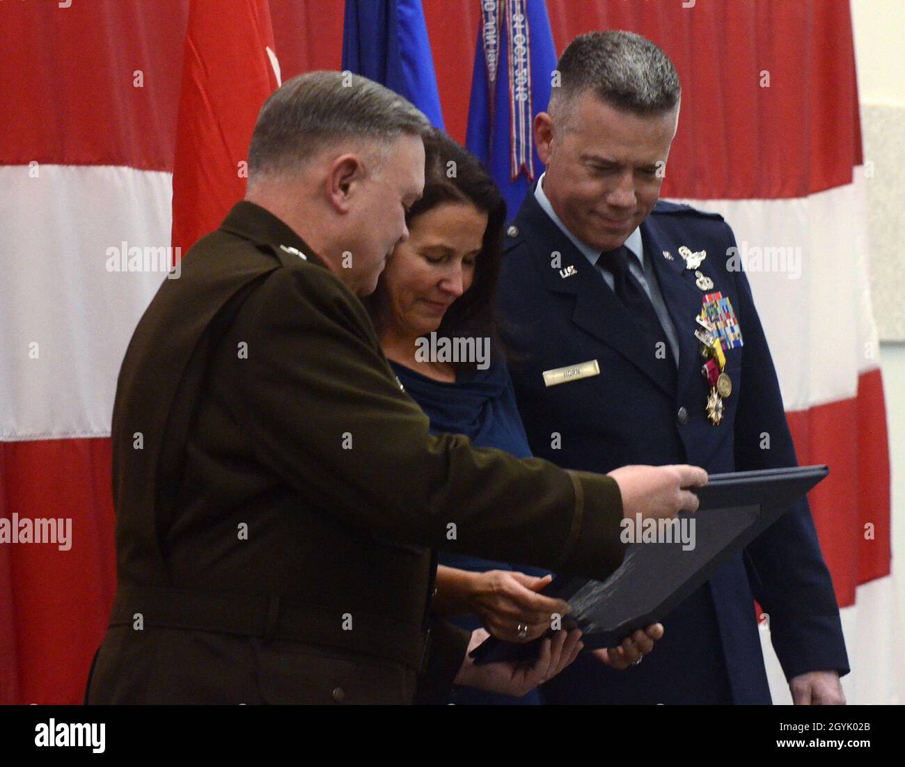 Kelli Horn (center) is presented with a Certificate of Appreciation ...