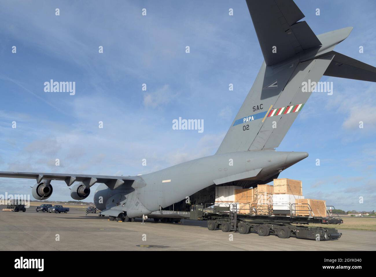 Civilians with the 727th Air Mobility Squadron offload the Boom ...
