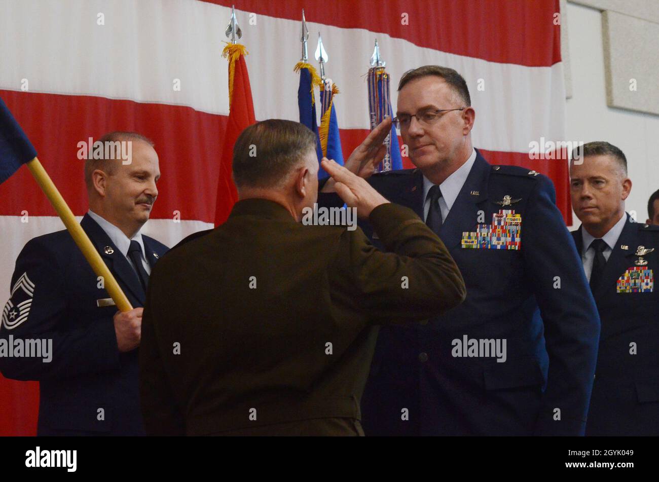 Col. Gent Welsh Jr. (center), renders a hand salute to Maj. Gen. Bret ...