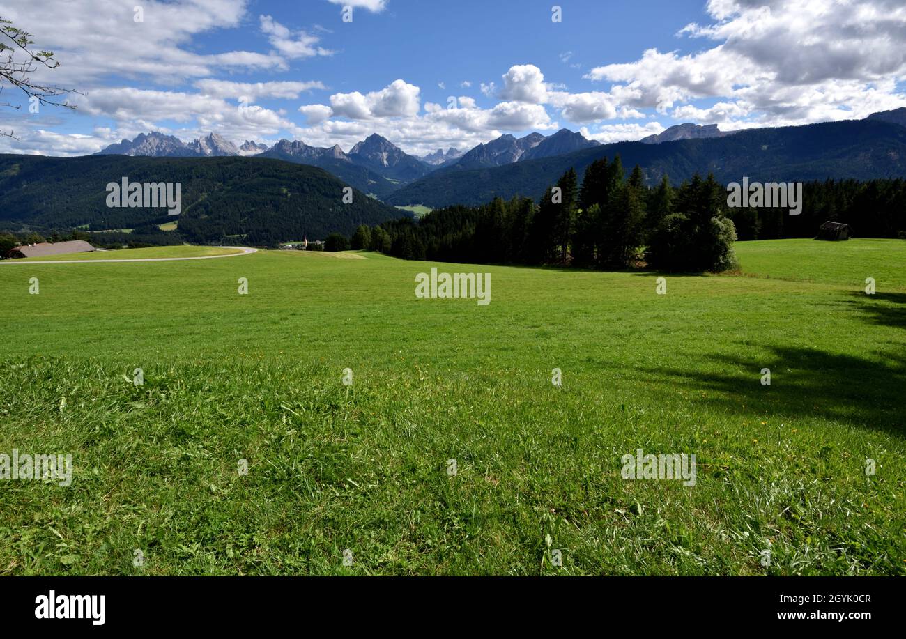 The vast meadows above the town of Tesido in front of a horizon of the ...