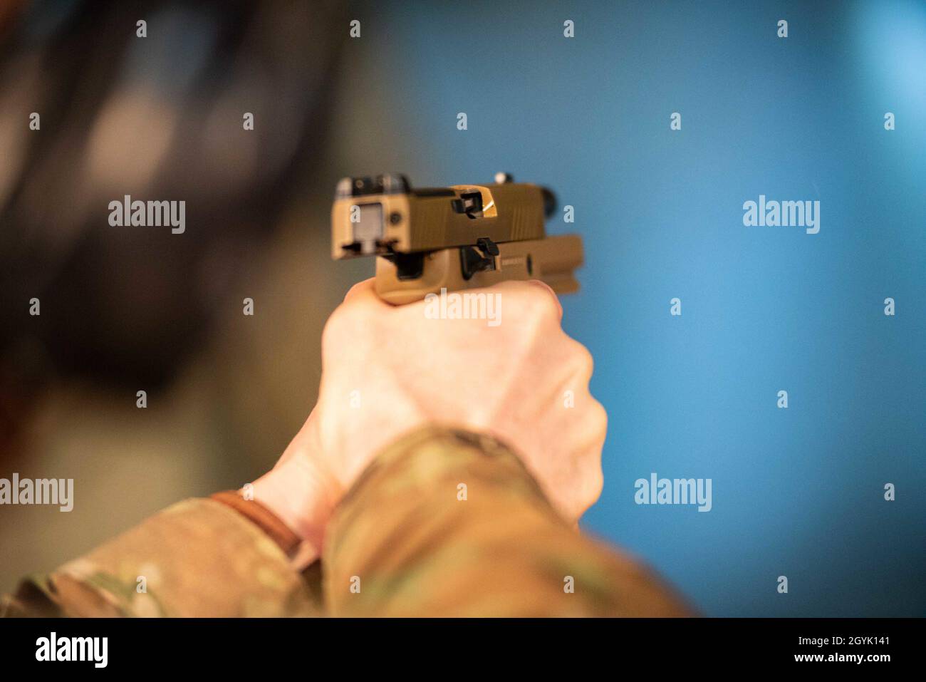 An M18 pistol’s slide locks to the rear after the last round of the ...