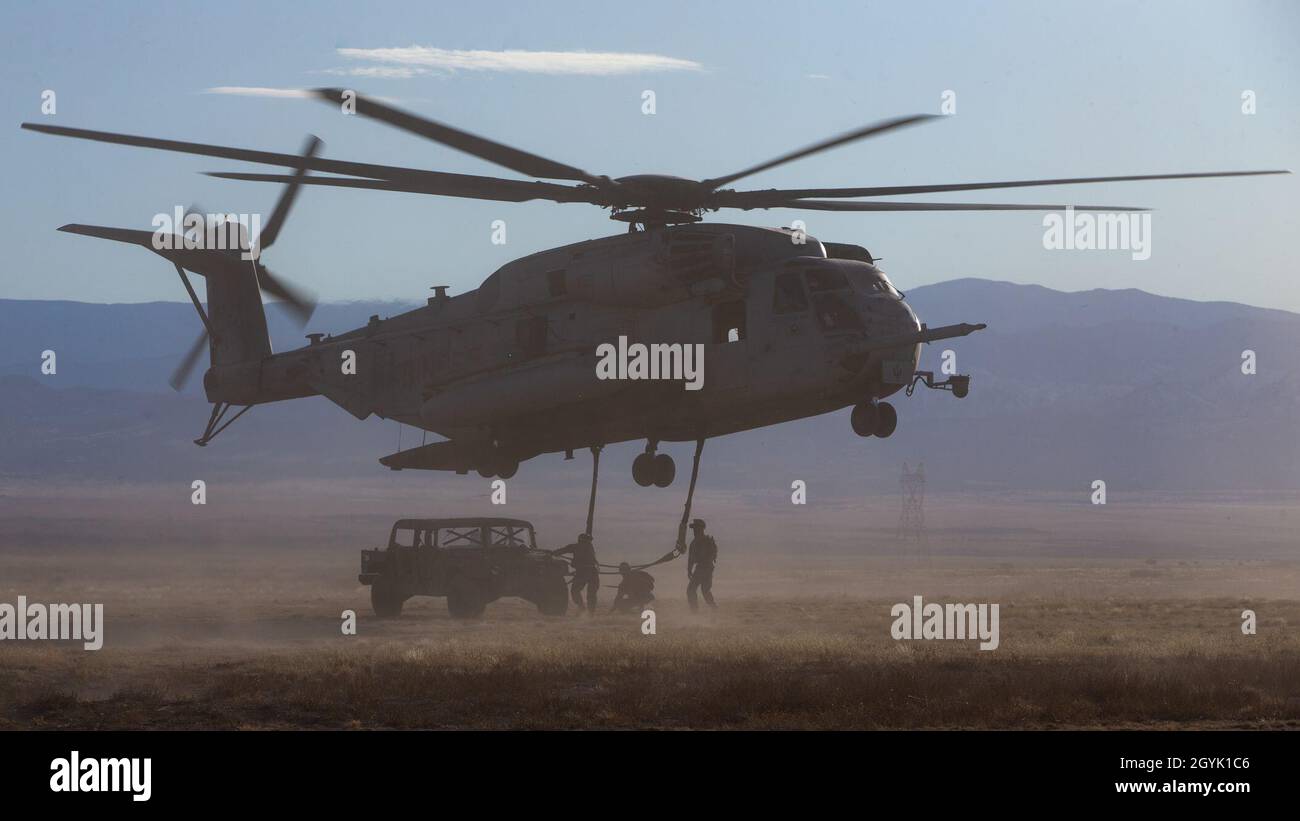 Marines with Marine Heavy Helicopter Squadron 461 attach a Humvee to ...