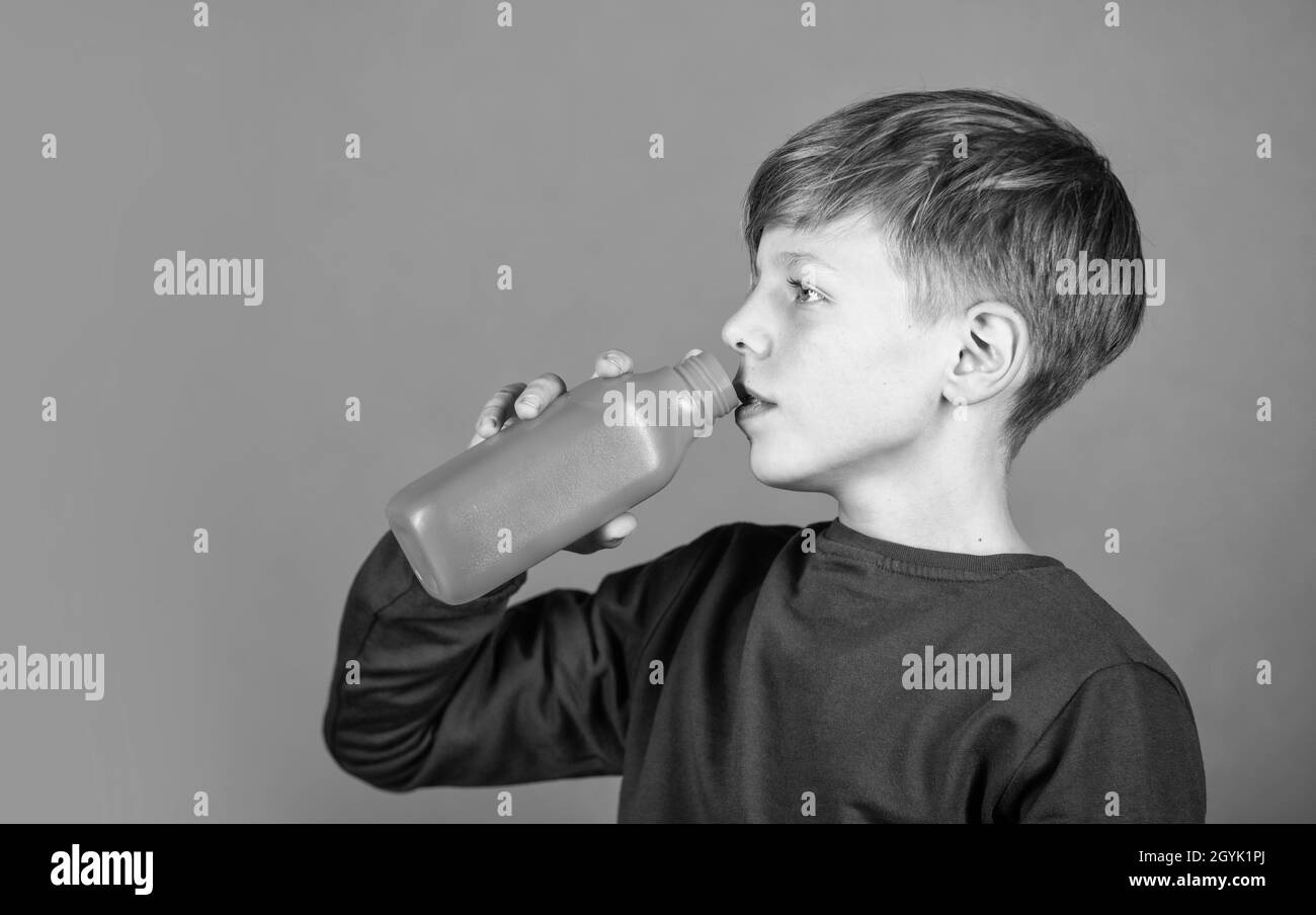 Healthy and yummy. Little child drink fruit juice. Good health habits ...