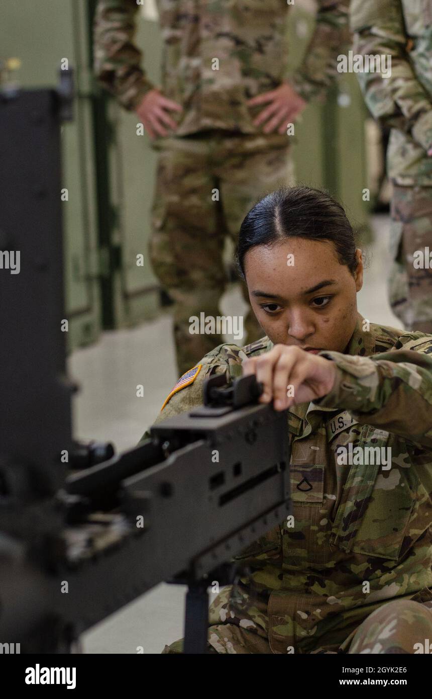 Pfc. Garr reassembles the M2 .50 caliber machine gun during a block of ...