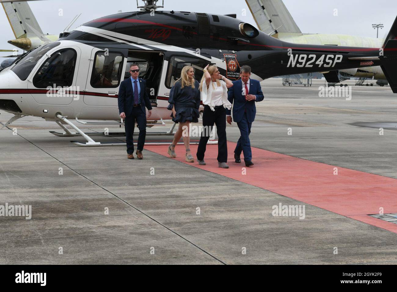 Georgia Gov. Brian Kemp (center) and his team arrive Jan. 12, 2020, at ...
