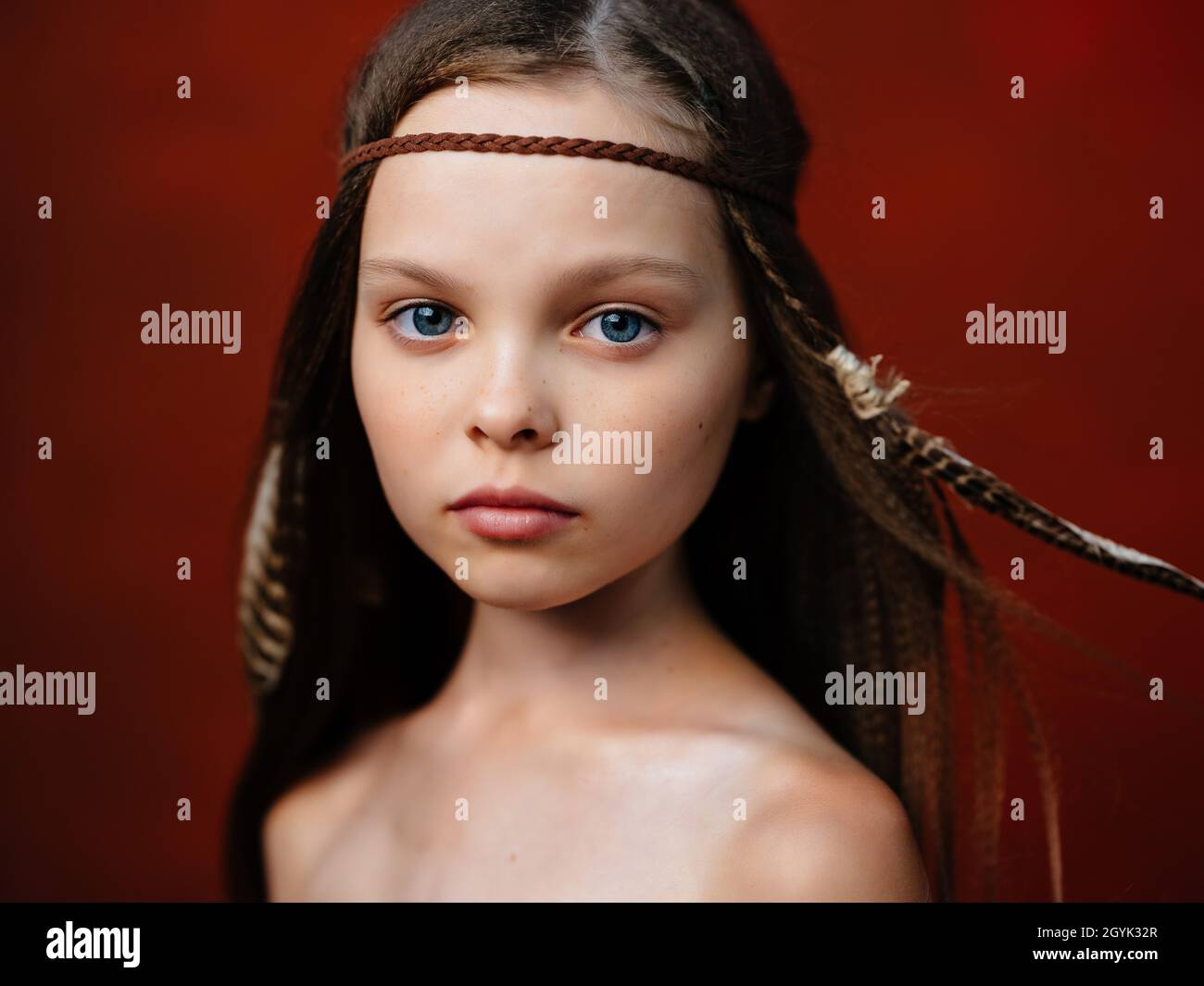 girl Indian ethnic hairstyle Apache red background Stock Photo - Alamy