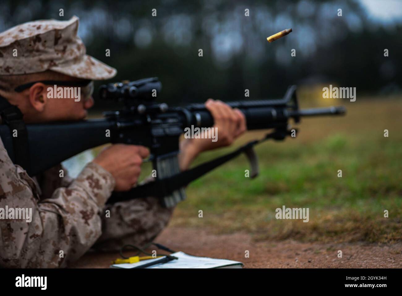 A Recruit with Echo Company, 2nd Recruit Training Battalion, fires ...