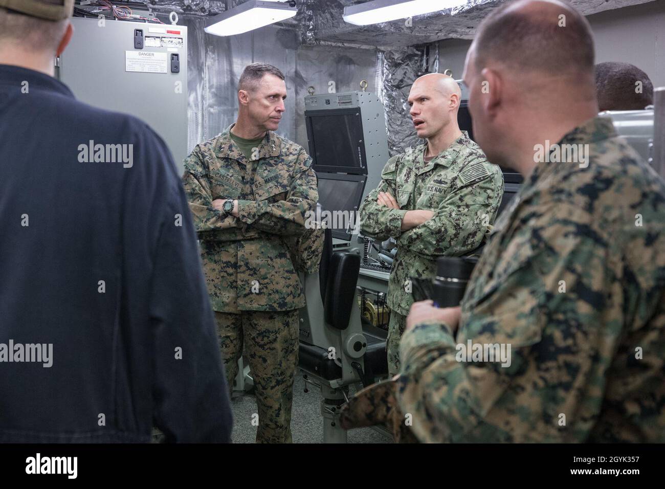 Members of the 1st Marine Division (1st MarDiv) staff tour the USS ...