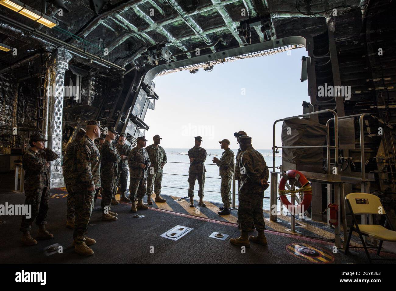 Members of the 1st Marine Division (1st MarDiv) staff tour the USS ...