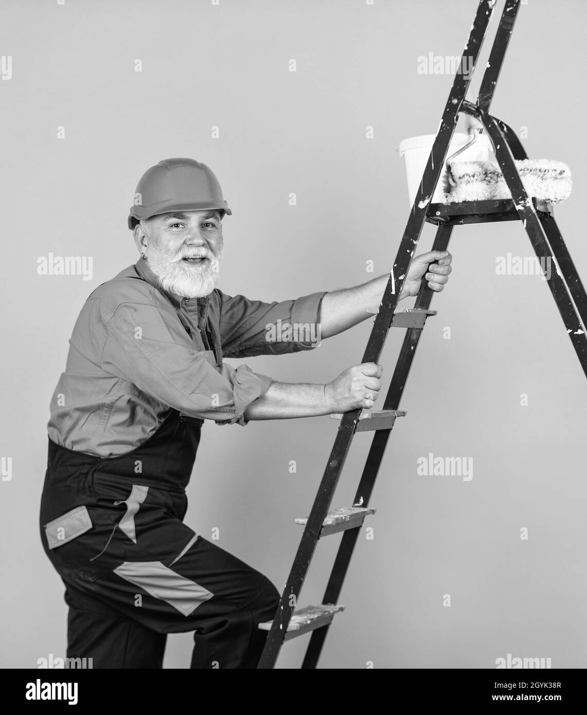 Repairman builder roller paint Black and White Stock Photos & Images ...