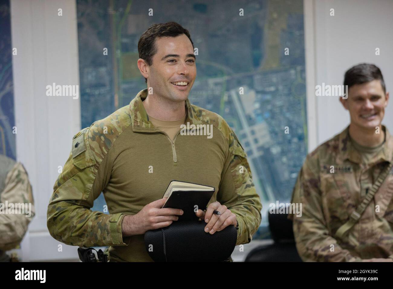 Australian Army Maj. Brett Edmonds listens during an After Action ...
