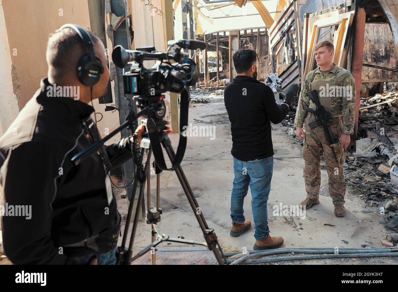 A reporter conducts an interview with a U.S. Soldier after his living ...
