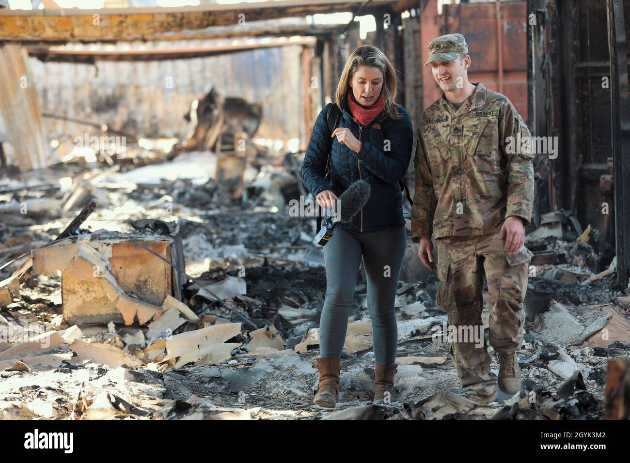 Holly Williams, CBS News field reporter, left, conducts an interview ...
