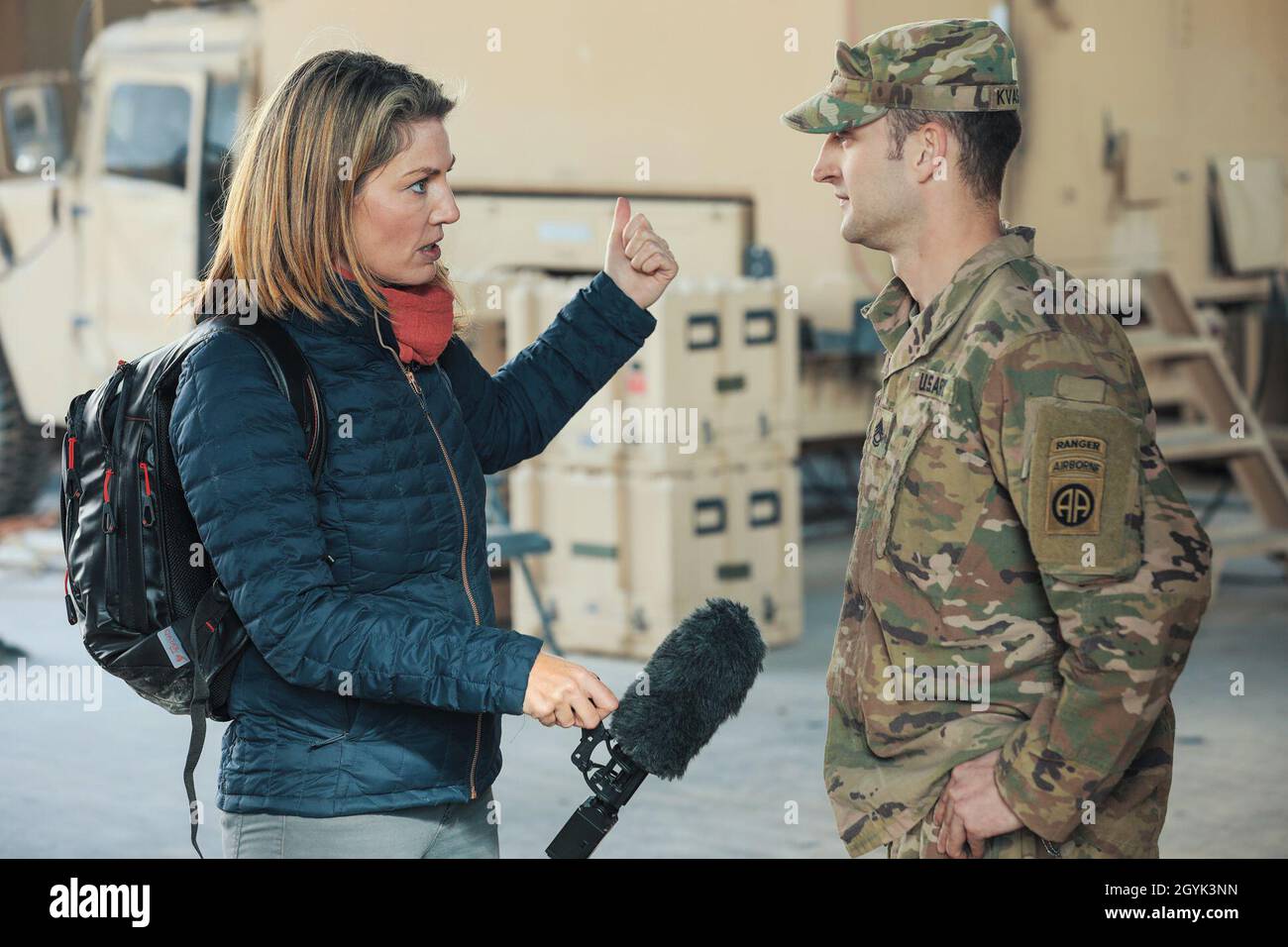 Holly Williams, CBS News field reporter, left, conducts an interview ...