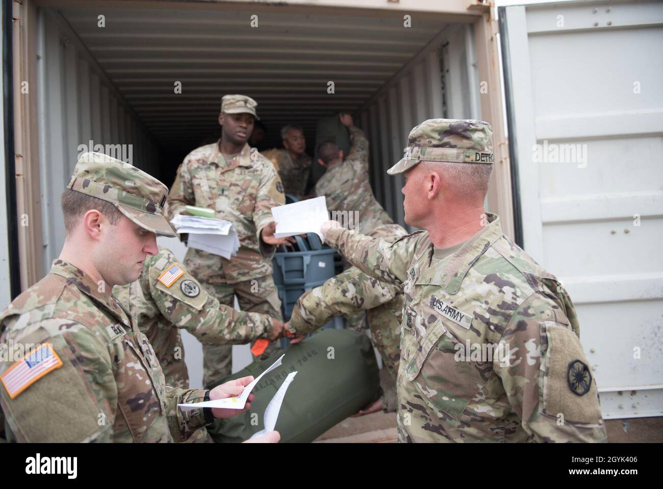 Sgt. Maj. Erick M. Detrich, HHC, 13th ESC Plans Sergeant Major, hands ...