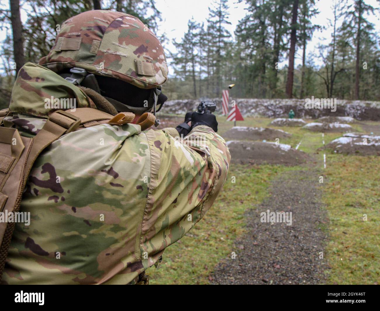 A United States Army Reserve Legal Command Soldier fires at a target ...
