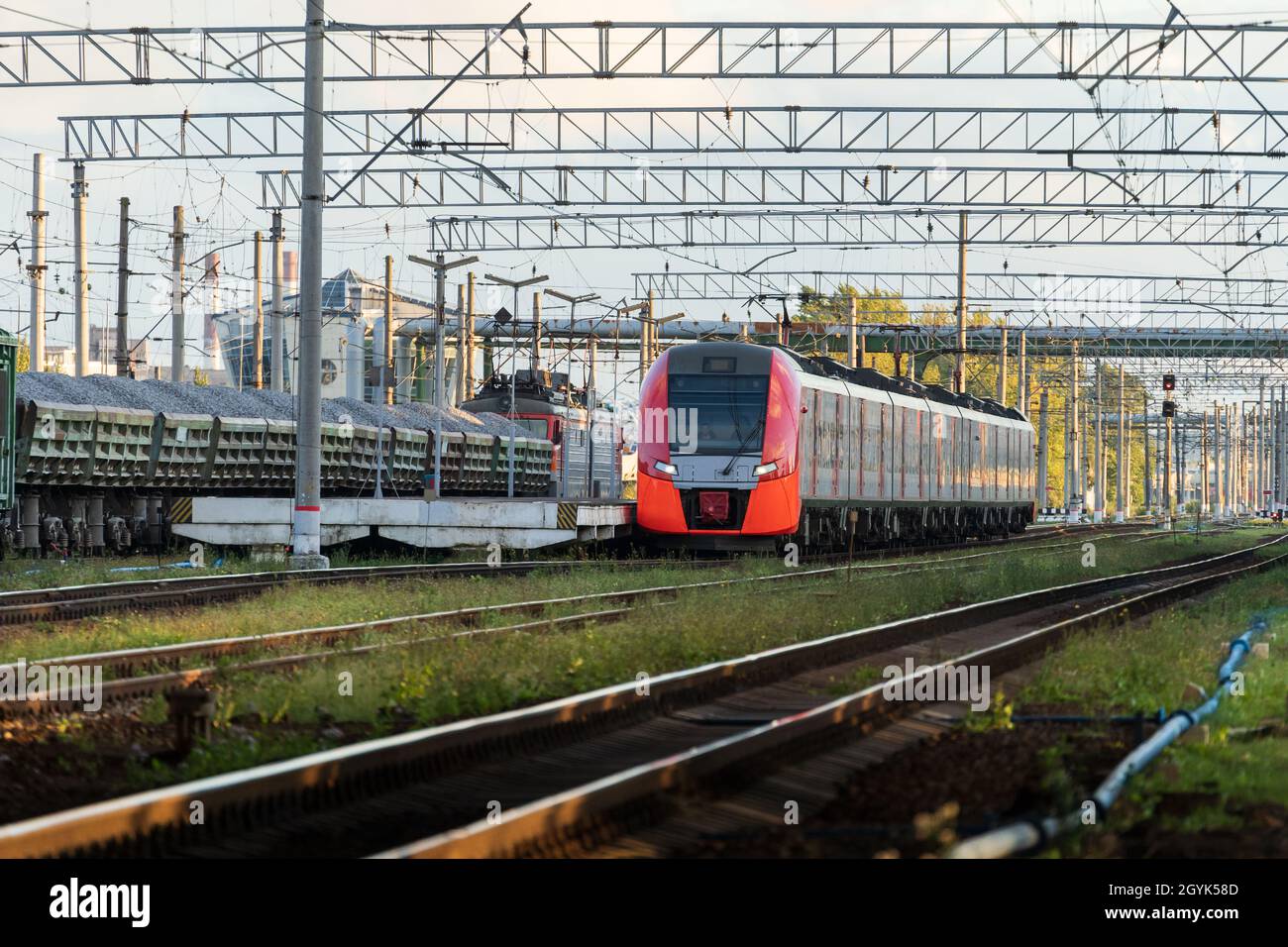 Modern intercity high speed train at sunset. Commercial suburban ...