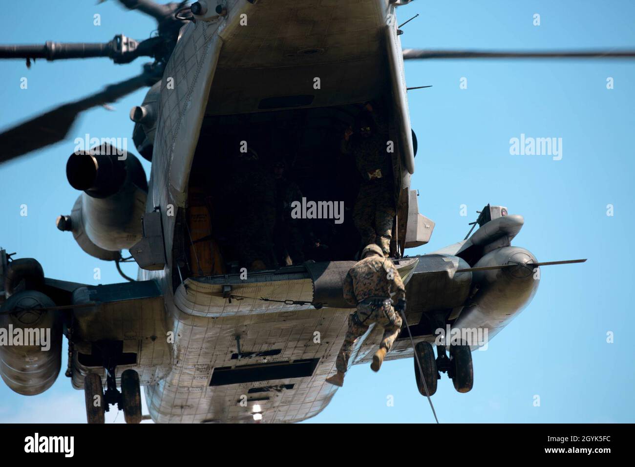 A U.S. Marine with 12th Marine Regiment, 3rd Marine Division rappels ...