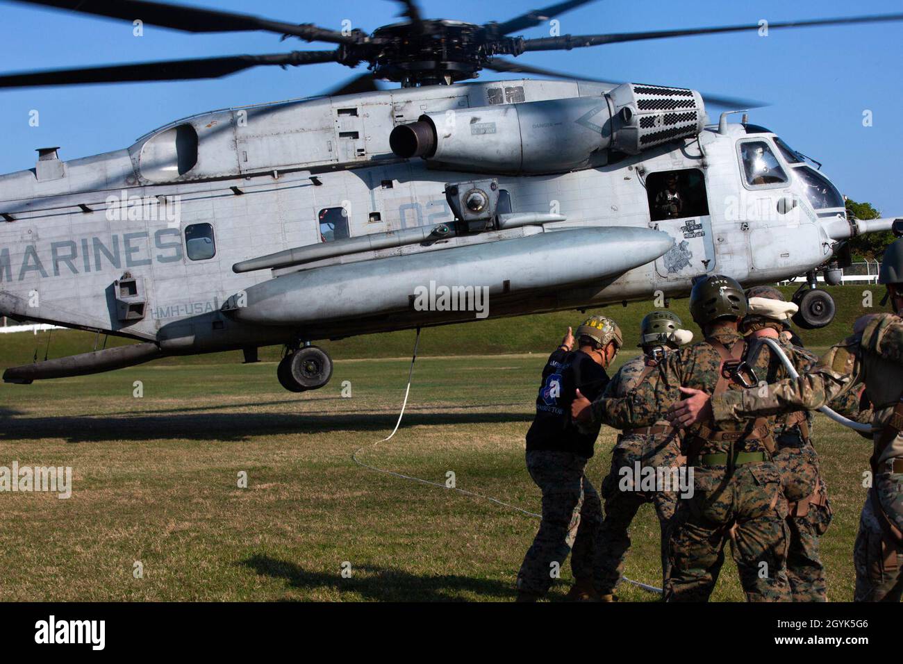 U.S. Marines with 12th Marine Regiment, 3rd Marine Division receive one ...
