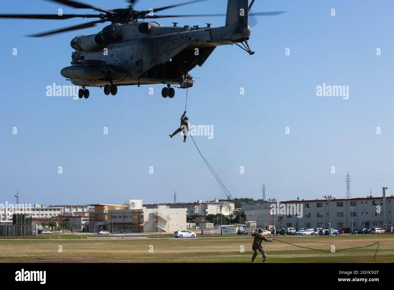 U.S. Marines with 12th Marine Regiment, 3rd Marine Division rappel off ...