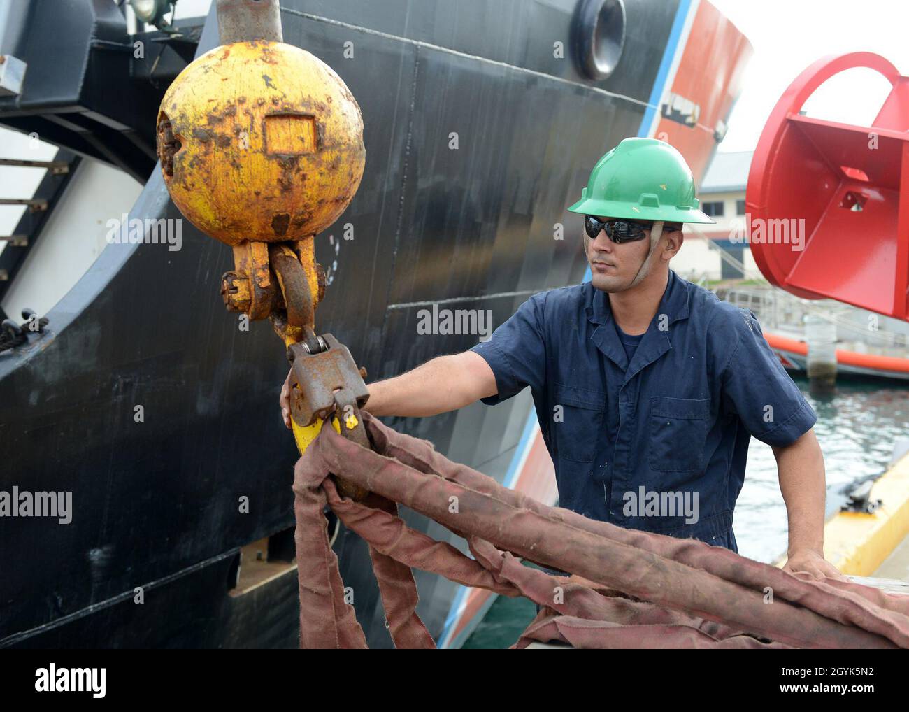 A crew member from the Coast Guard Cutter Walnut (WLB 205) prepares the ...