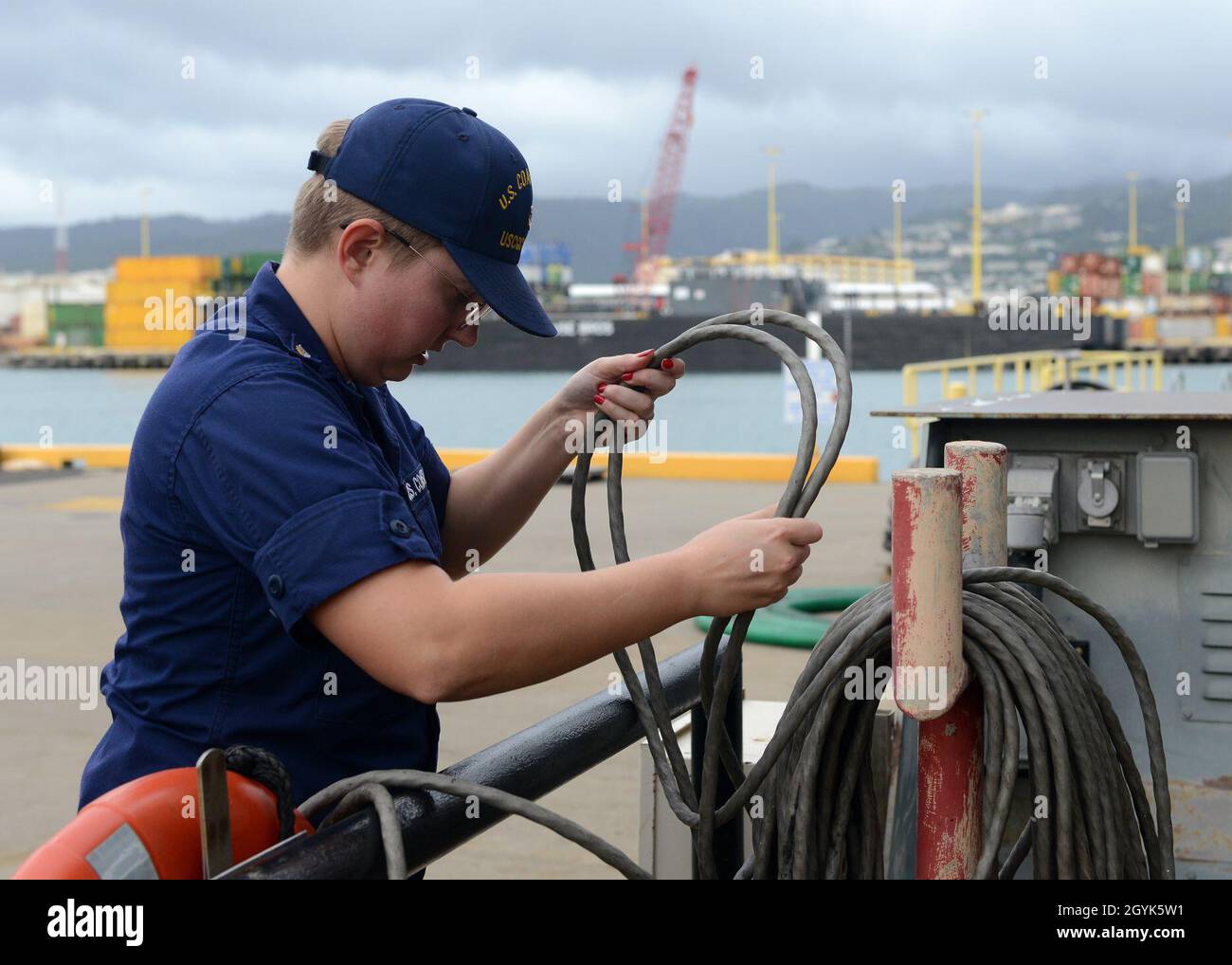 A crew member from the Coast Guard Cutter Walnut (WLB 205) prepares the ...