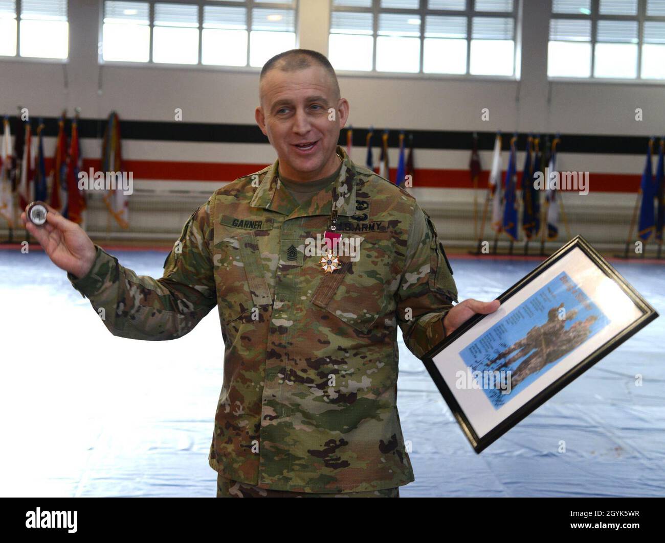 Command Sgt. Maj. Todd M. Garner addresses the crowd during his award ...