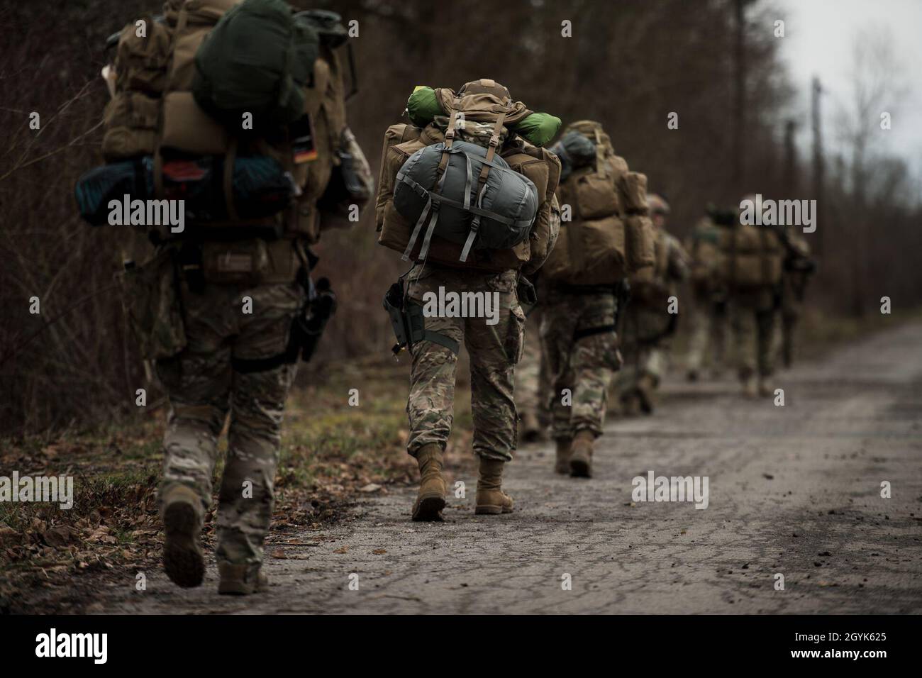 U.S. Airmen assigned to the 435th Security Forces Squadron carry their ...
