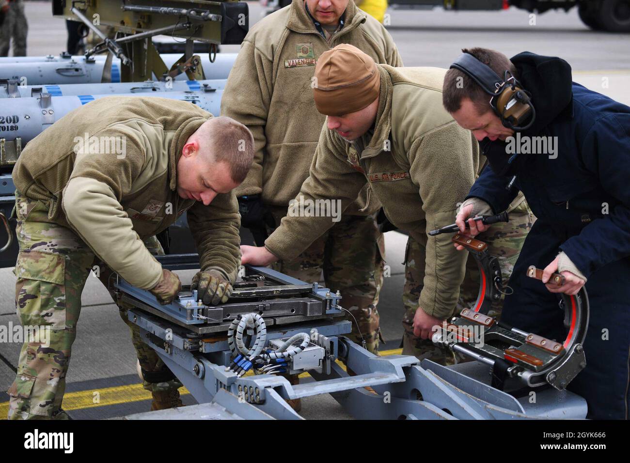 U.S. Air Force 52nd Fighter Wing Airmen prepare an MHU-83 jammer to ...