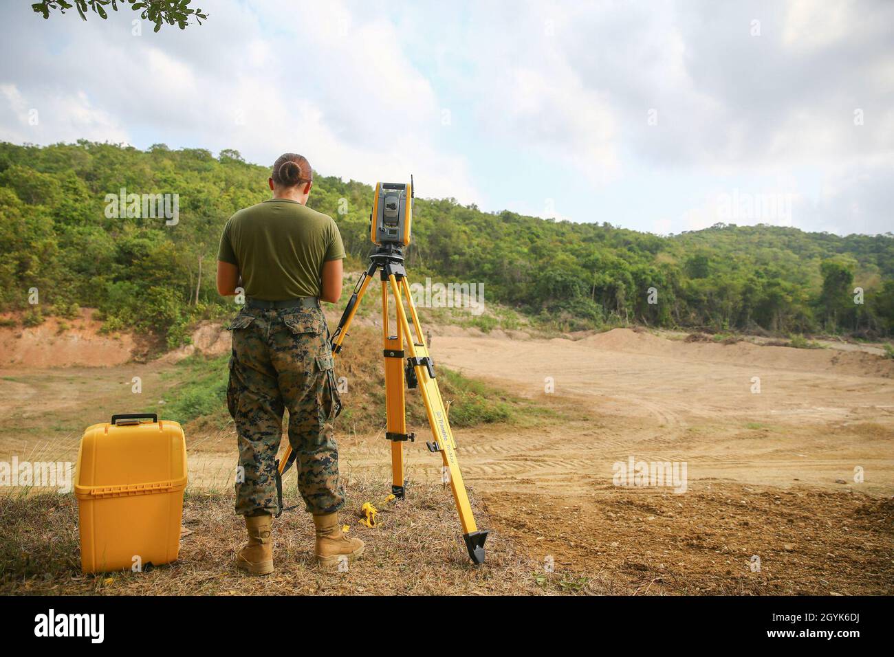 U.S. Marine Corps Lance Cpl. Autumn Richard uses a Trimble S6 total ...