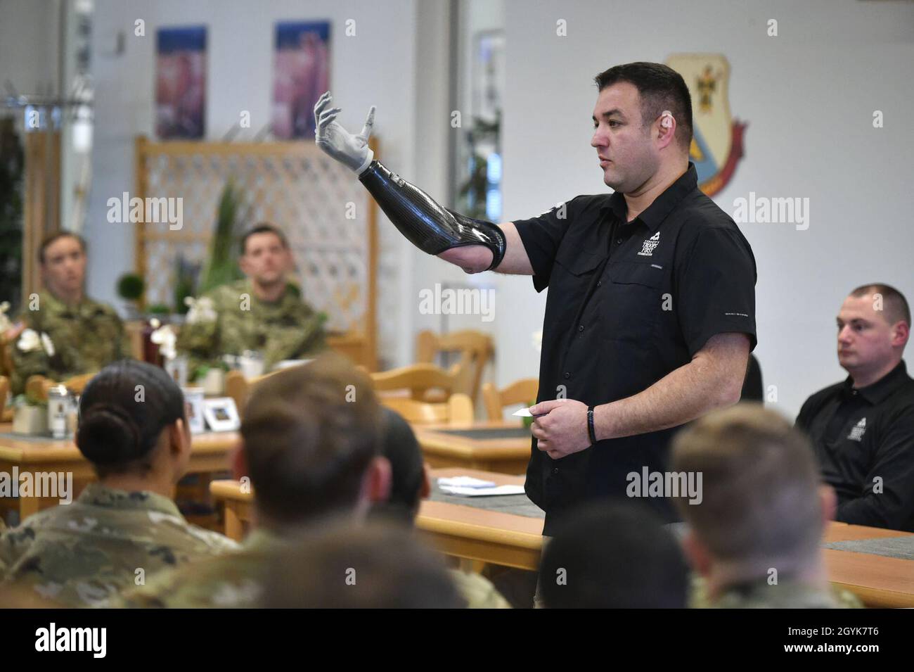 Retired U.S. Army Master Sgt. Leroy Petry, standing, associated with ...
